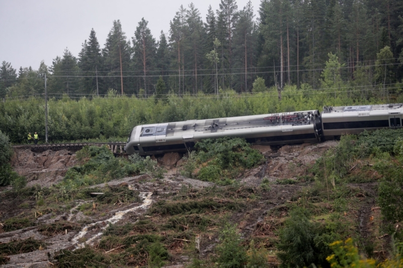 Train derailed in Sweden after embankment gets washed away by rain ...